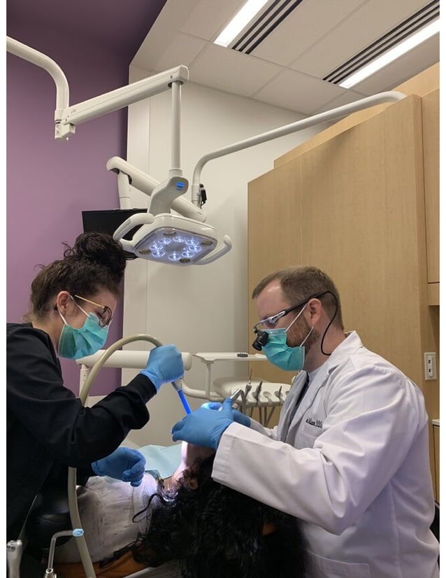 Dr. McQueen performing root canal at McQueen Dental | PDF