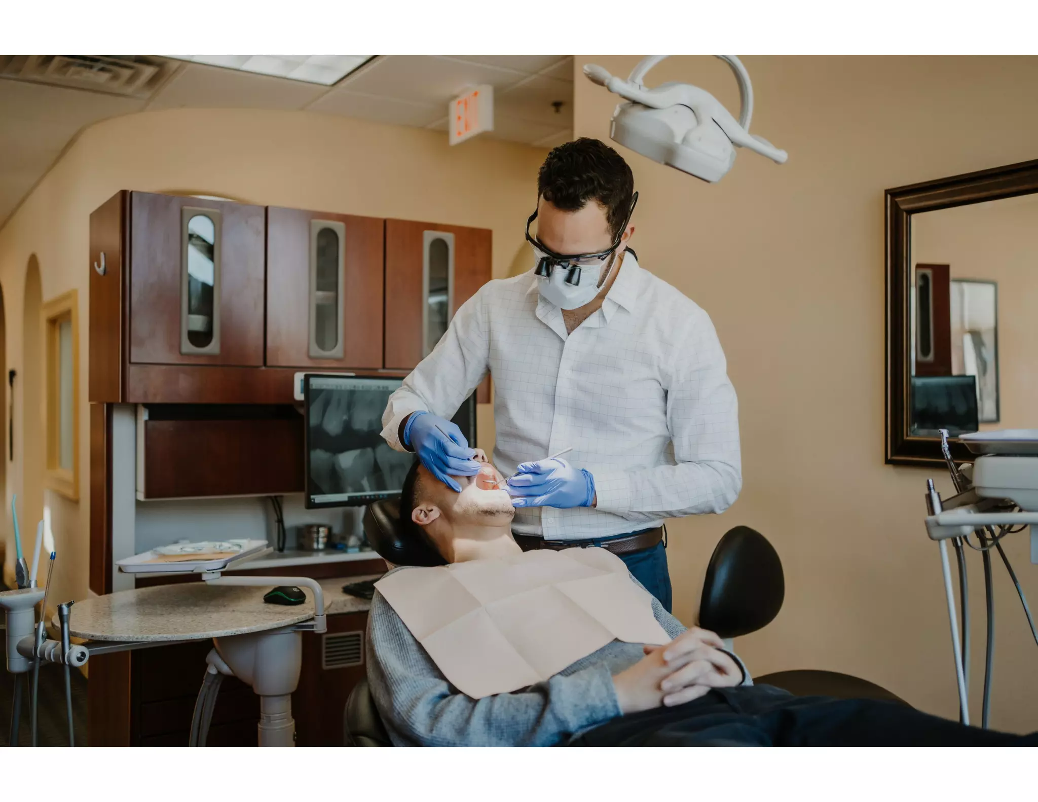 Dr. Alon Bekerman, DMD performing root canal at Premiere Dental of ...