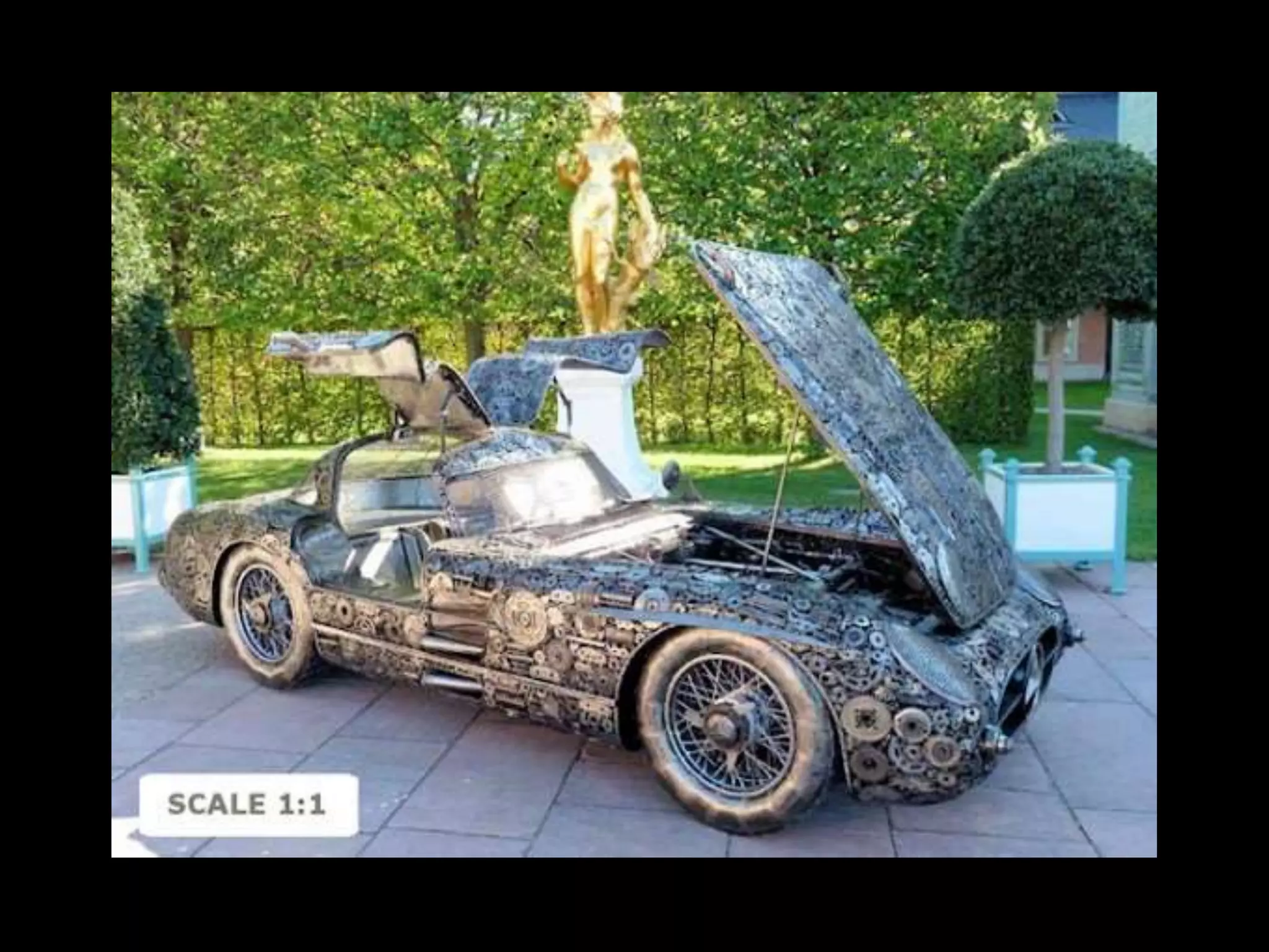 Sculpturen van auto onderdelen | PPTX