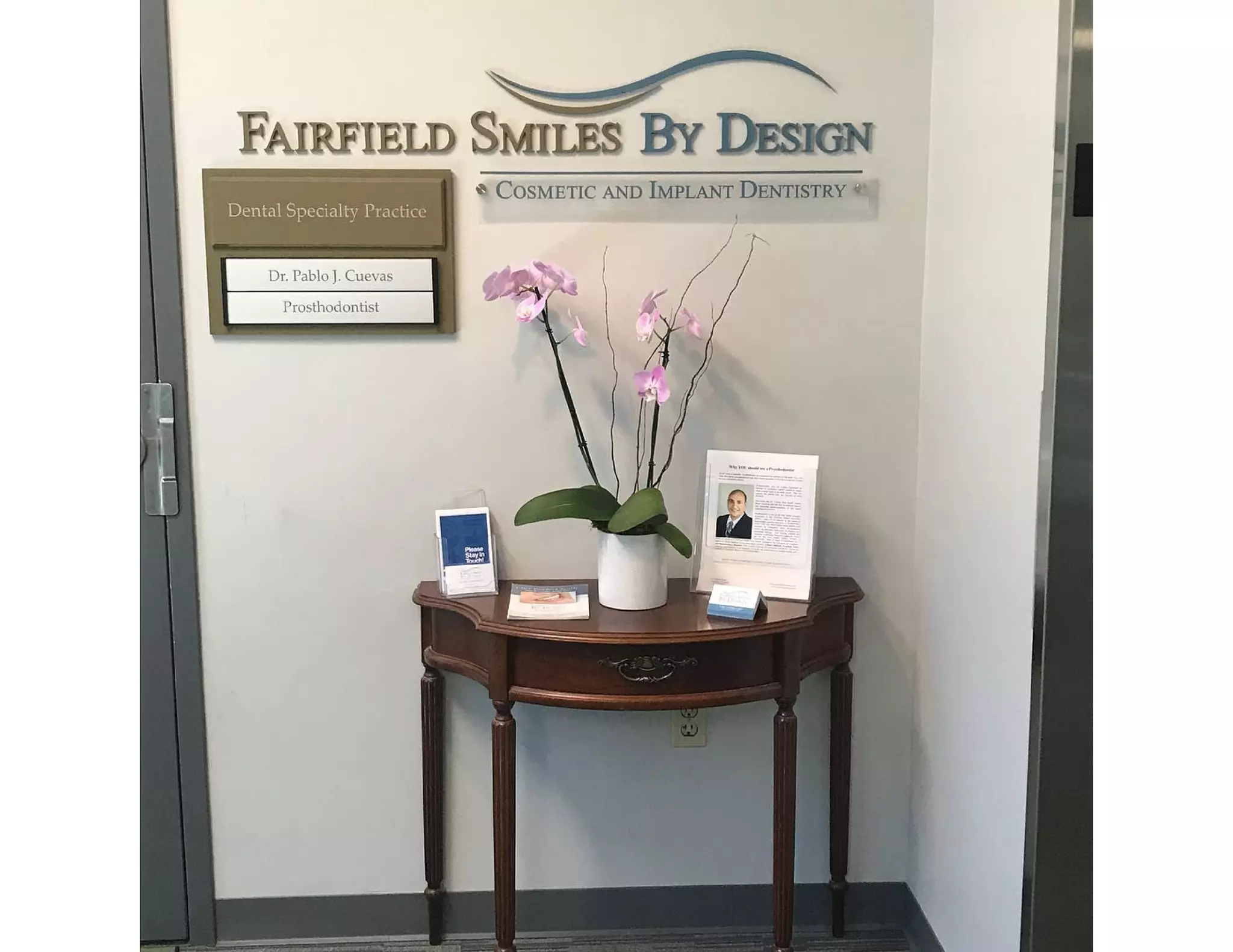 Signage at the front door at Fairfield Smiles by Design | PPT